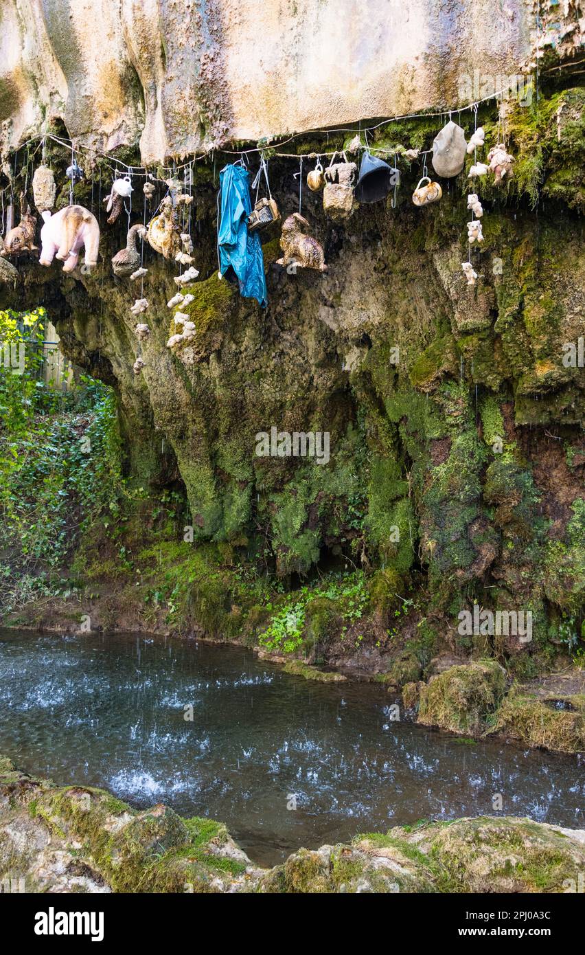 Objects hung in the falling water of the petrifying well at Mother ...