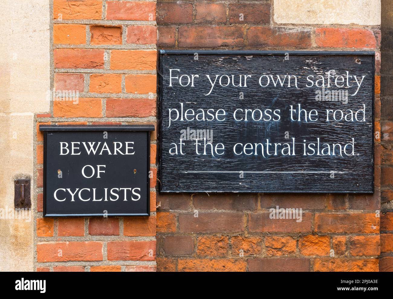 Beware of cyclists, a safety warning sign on a building in Eton ...