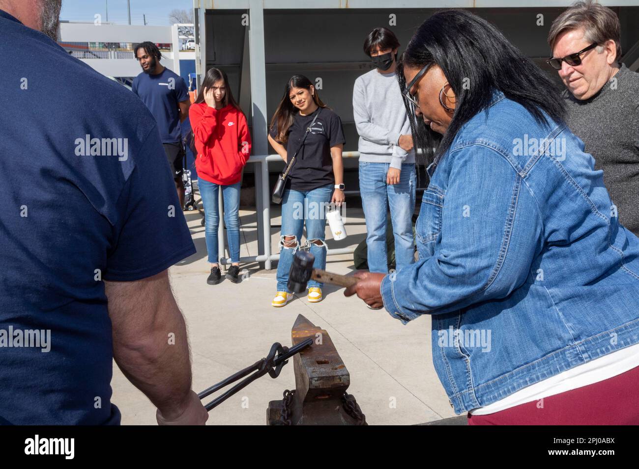 Denver, Colorado, Sharletta Evans hammers on a gun barrel during a gun ...