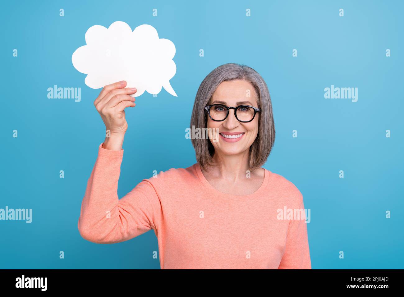Photo of dreamy cheerful lady dressed coral shirt eyewear holding mind ...