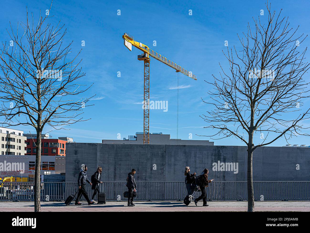 Construction crane behind a concrete wall, Friedrichshain, Berlin ...