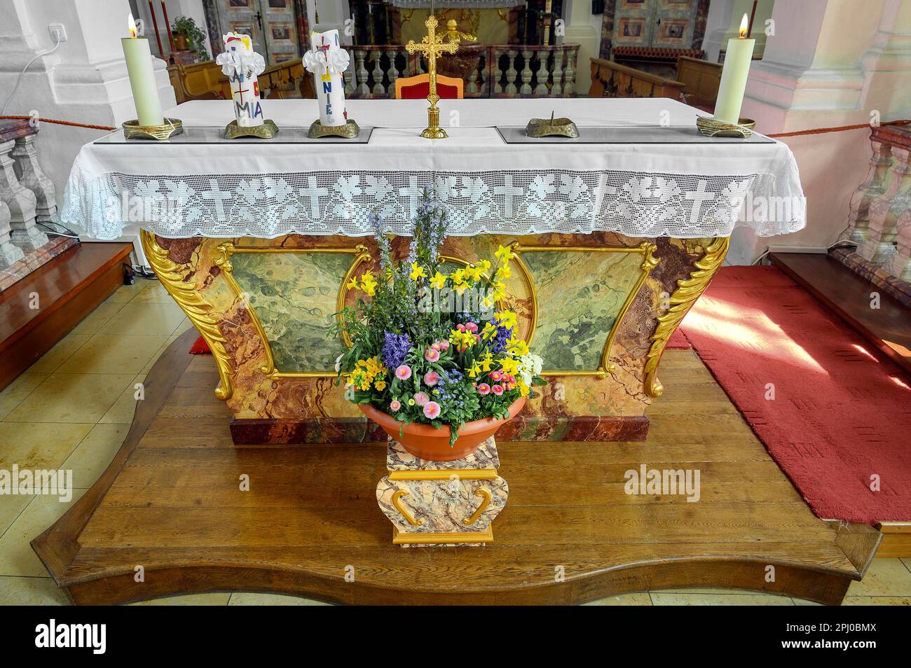 Main altar with candles and floral decorations, pilgrimage church of ...