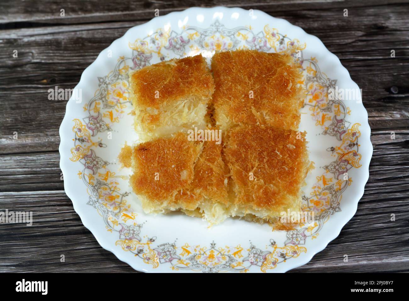 A traditional middle eastern dessert Knafeh Konafa made with spun ...