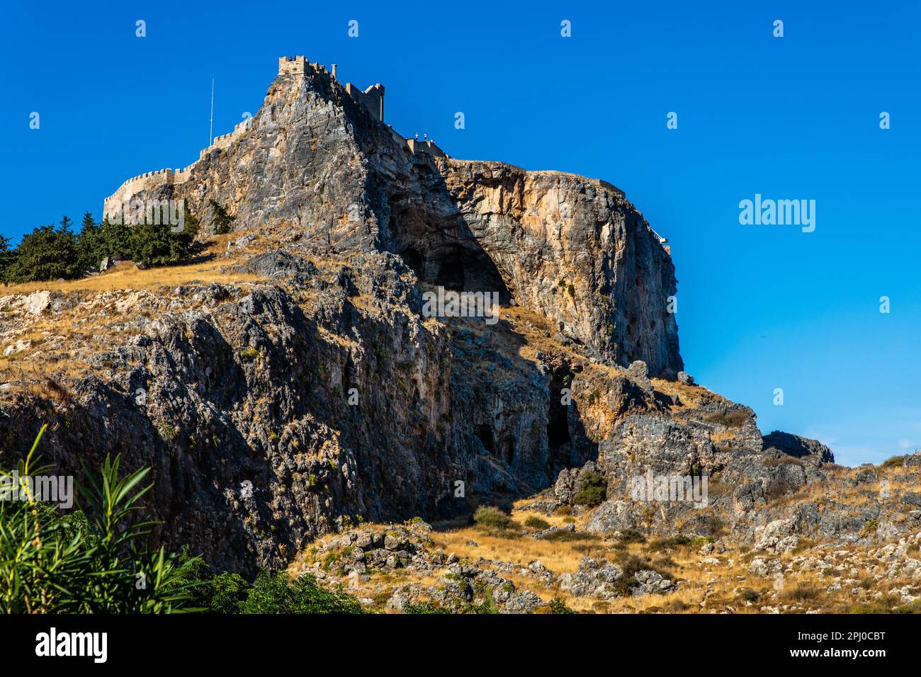 Acropolis of Lindos on a steeply rising cliff above the town, Rhodes ...