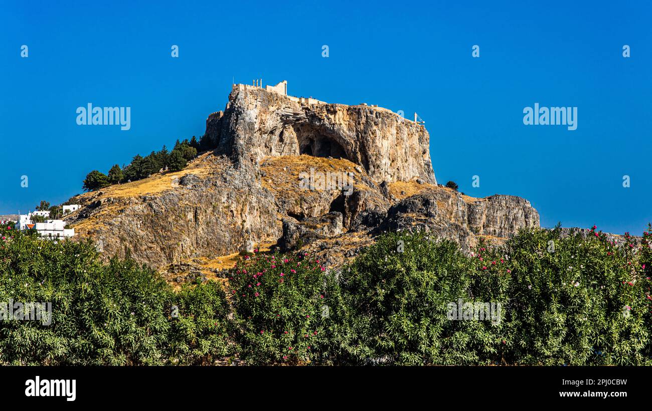 Acropolis of Lindos on a steeply rising cliff above the town, Rhodes ...