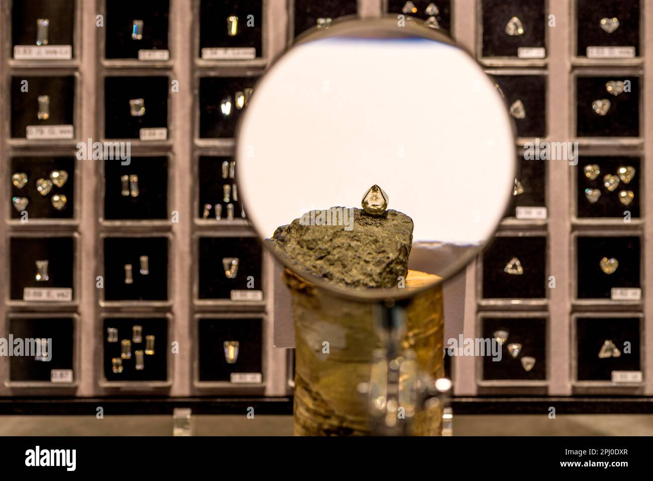 Diamond with inclusion, star in rough diamond, under magnifying glass ...