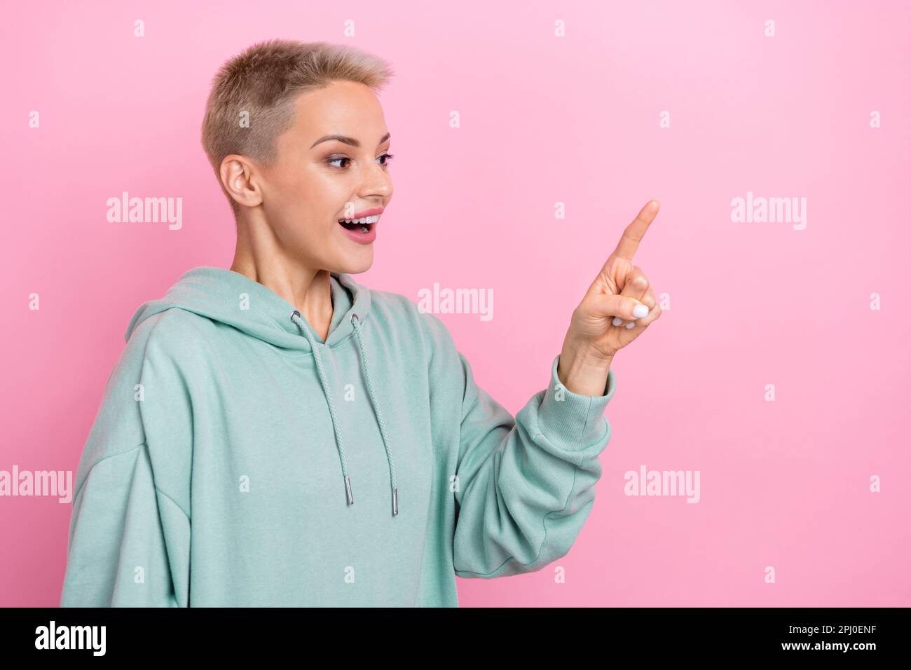 Photo portrait of lovely young lady point finger empty space talk speak ...