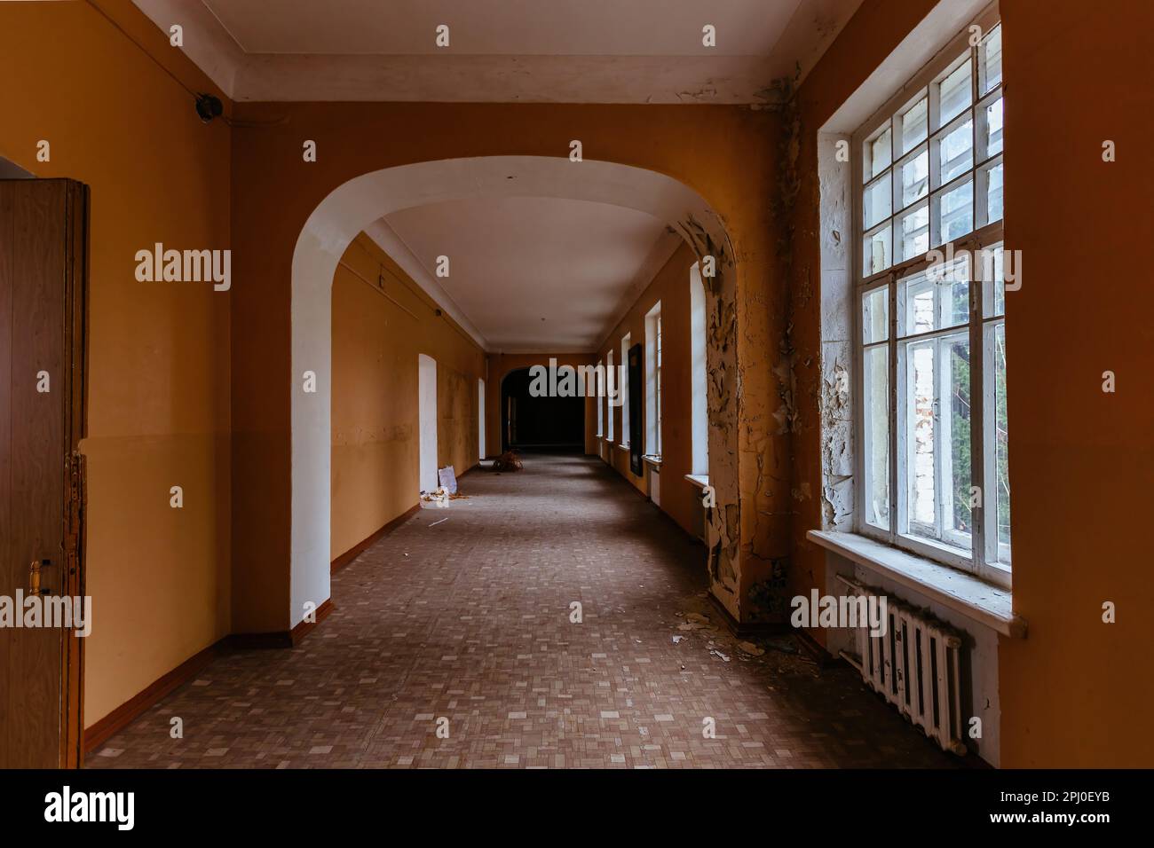 Dark dirty corridor of old abandoned school Stock Photo - Alamy