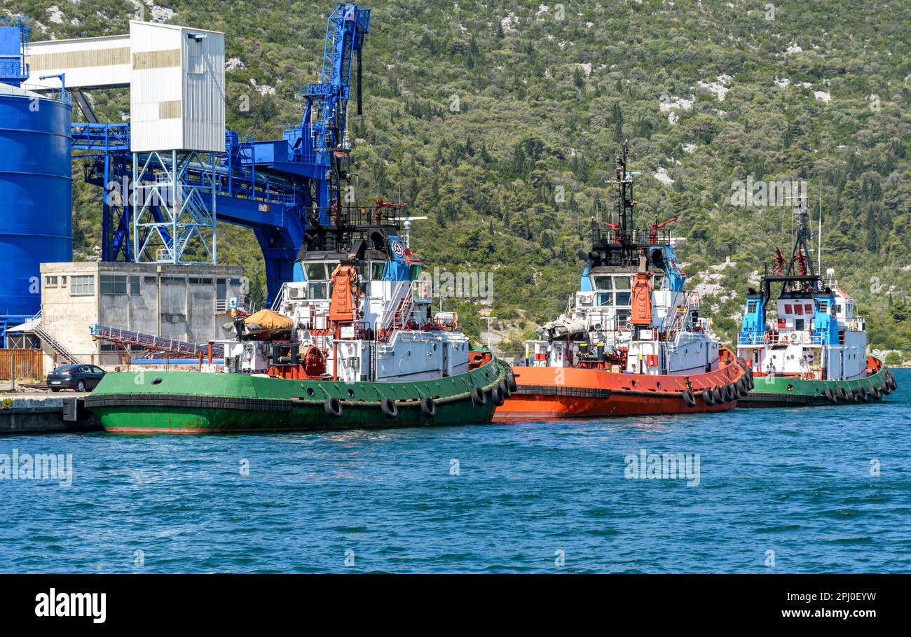 A row of tugboats docked in the port of Ploce in Croatia Stock Photo ...