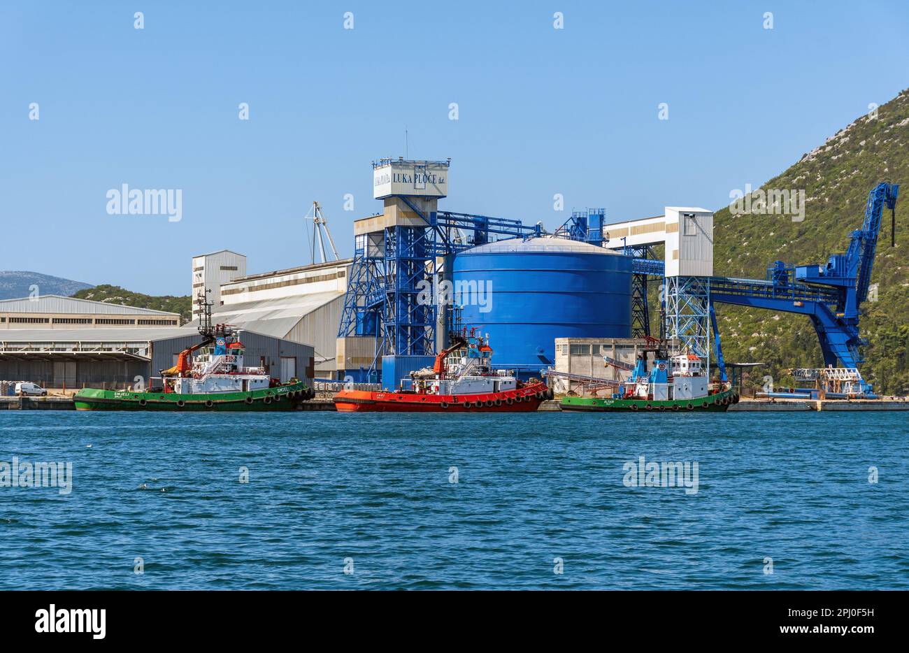 A row of tugboats docked in the port of Ploce in Croatia Stock Photo ...