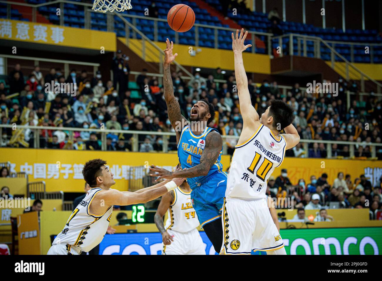 Zhuji, China's Zhejiang Province. 30th Mar, 2023. Darius Adams (C) of ...