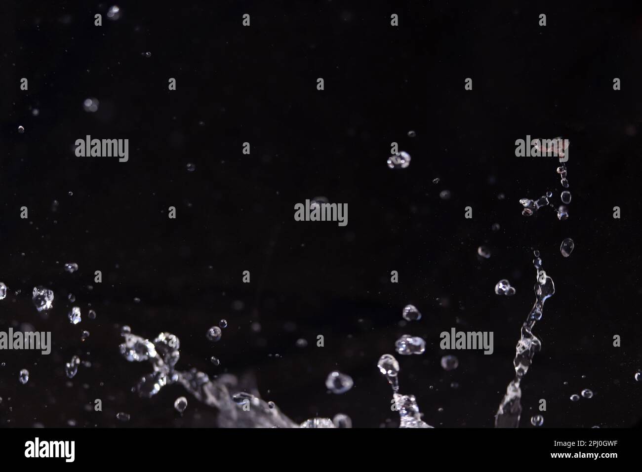 Splash of water on flat surface Stock Photo - Alamy