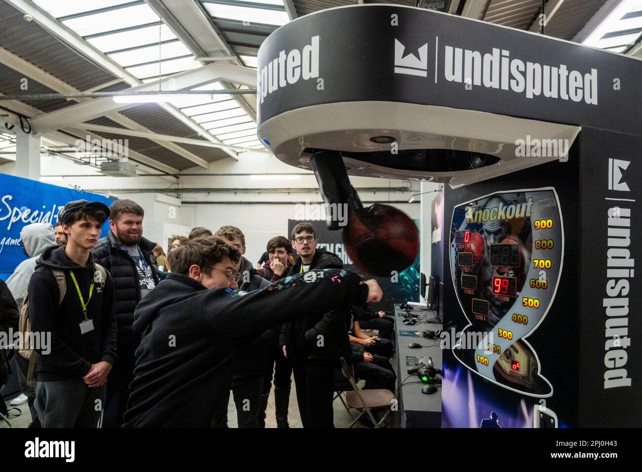 London, UK. 30 March 2023. Visitors try a punching machine promoting ...