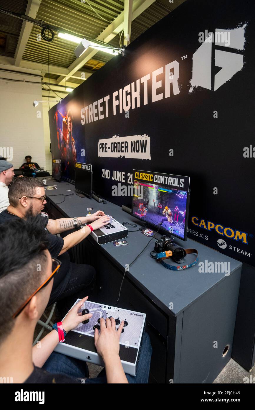 London, UK. 30 March 2023. Visitors play the upcoming 'Street Fighter 6 ...