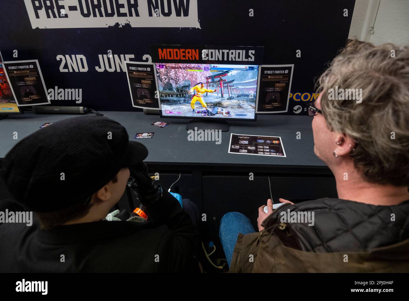 London, UK. 30 March 2023. Visitors play the upcoming 'Street Fighter 6 ...