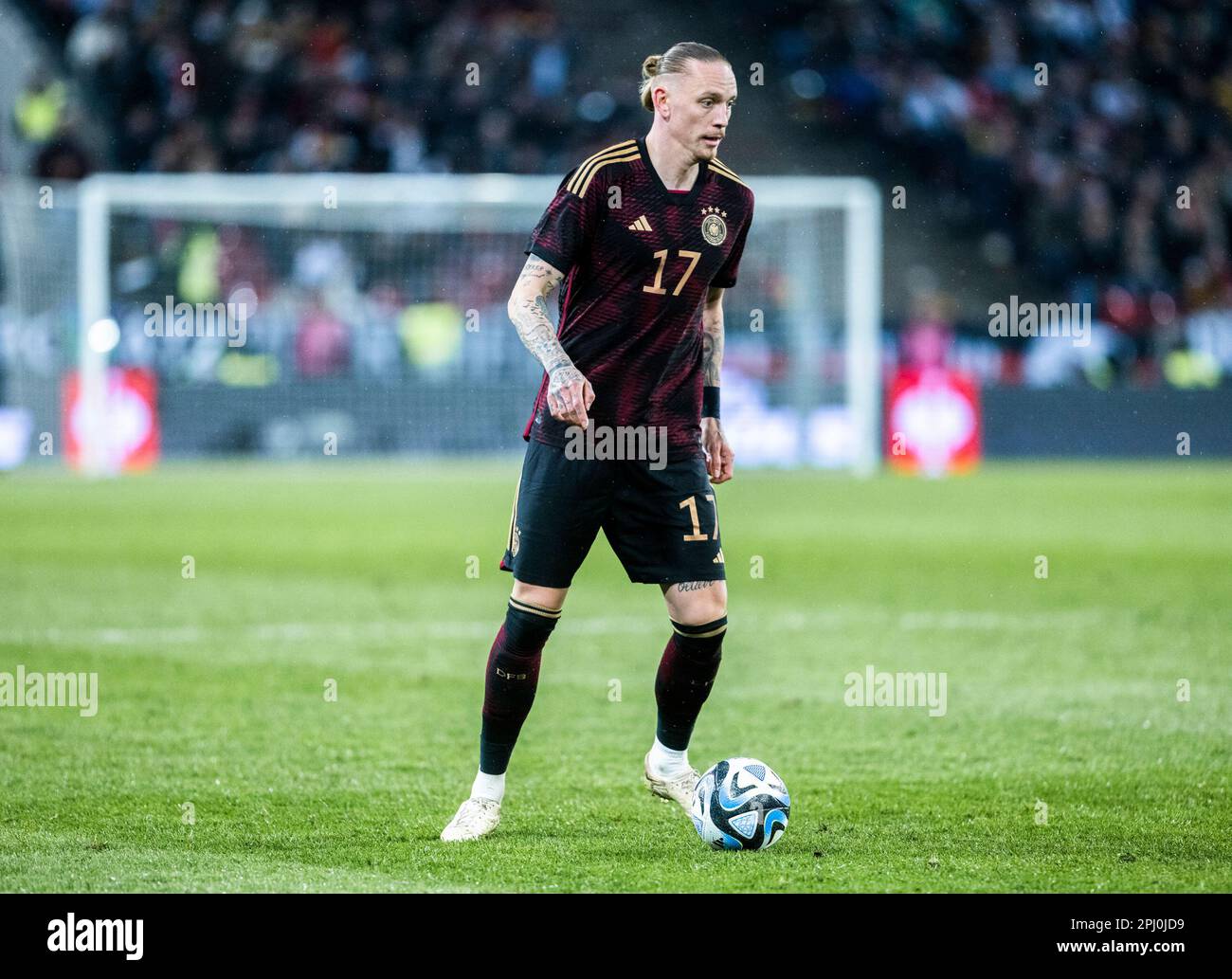 Koeln, RheinEnergieStadion, 28.03.23: Marius Wolf of Germany runs with ...