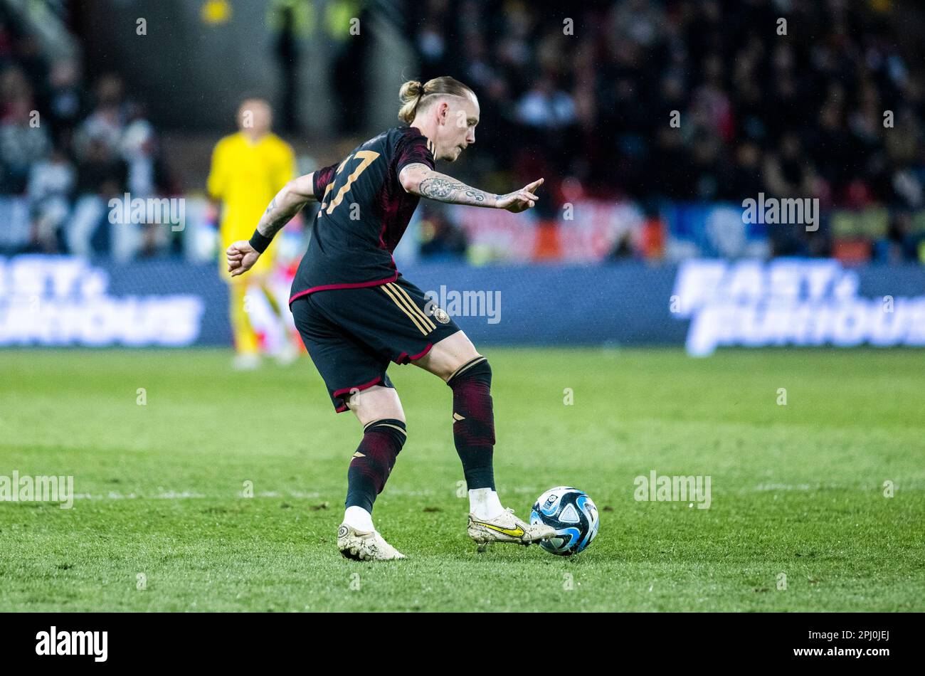 Koeln, RheinEnergieStadion, 28.03.23: Marius Wolf of Germany runs with ...
