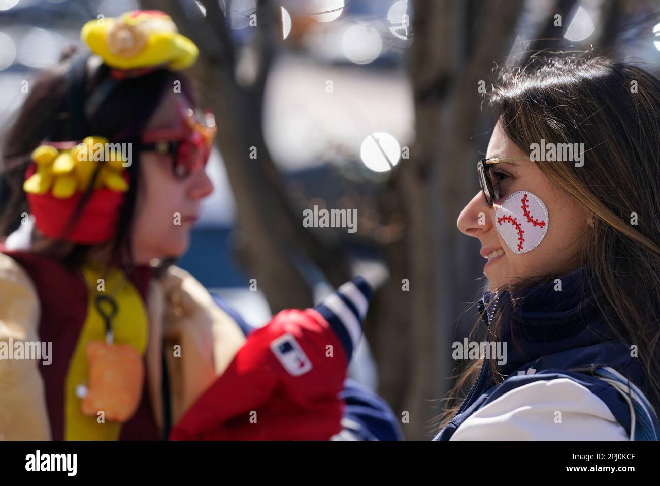 Sisters Dana Fontanez, right, and Brett Phillips-Gleis wait outside ...