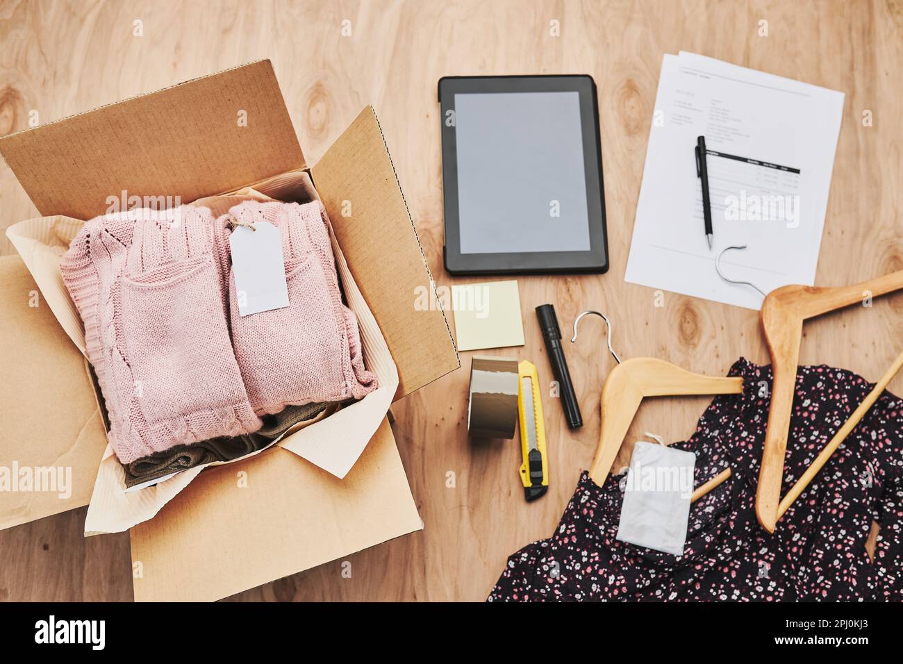 Packing online order to delivery to customer. Preparing parcel box with ...