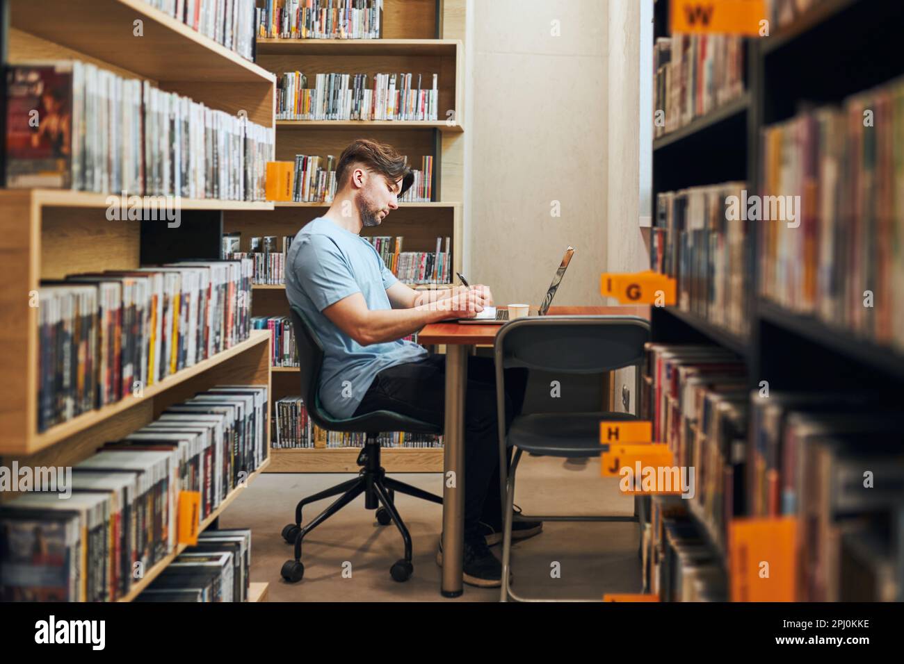 Man using computer in public library hi-res stock photography and ...