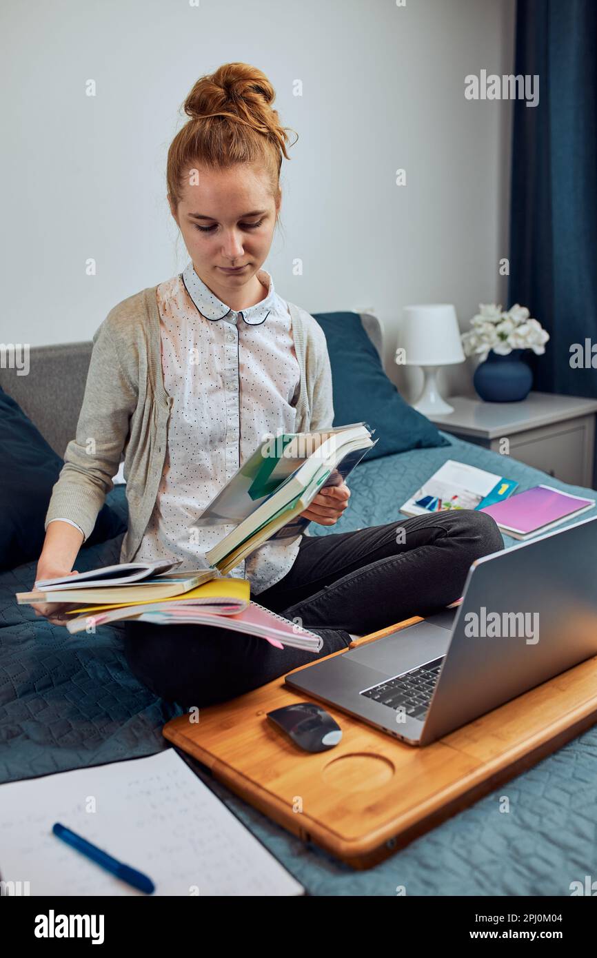 Young woman student having classes, learning online, watching lesson ...