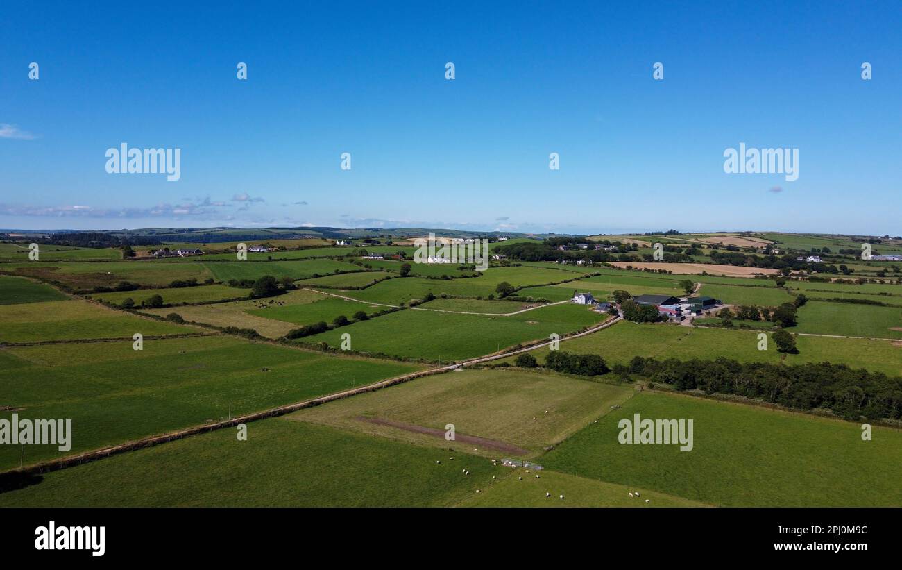 Clear sky over the green fields of southern Ireland. Picturesque summer ...