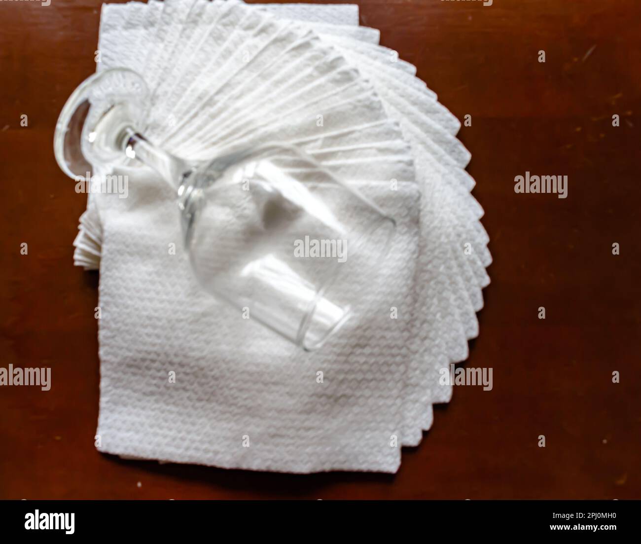 A glass on top of a bunch of napkins Stock Photo - Alamy