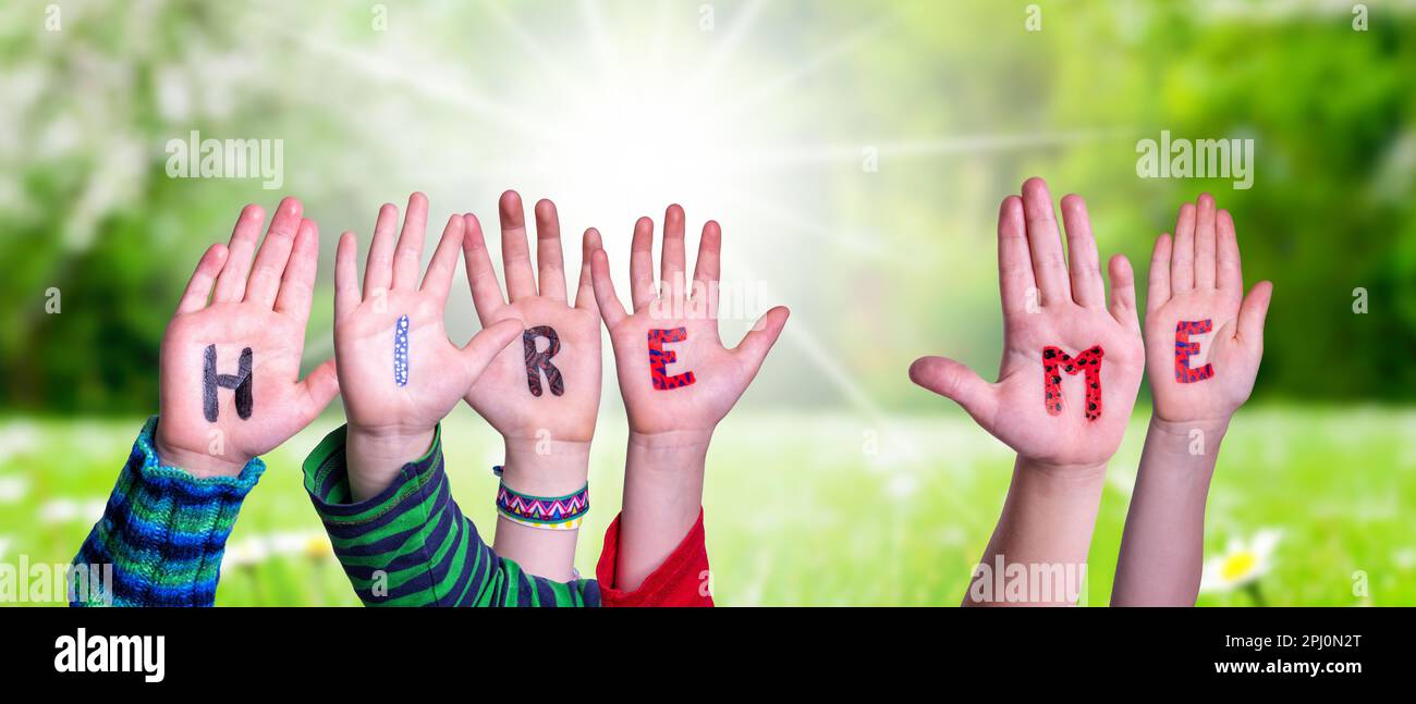 Children Hands Building Word Hire Me, Grass Meadow Stock Photo - Alamy