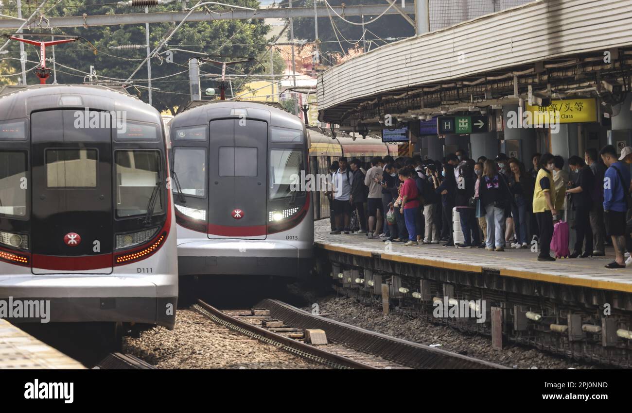 MTR trains approach to the MTR station. Hong Kong MTR Corporation (MTRC ...