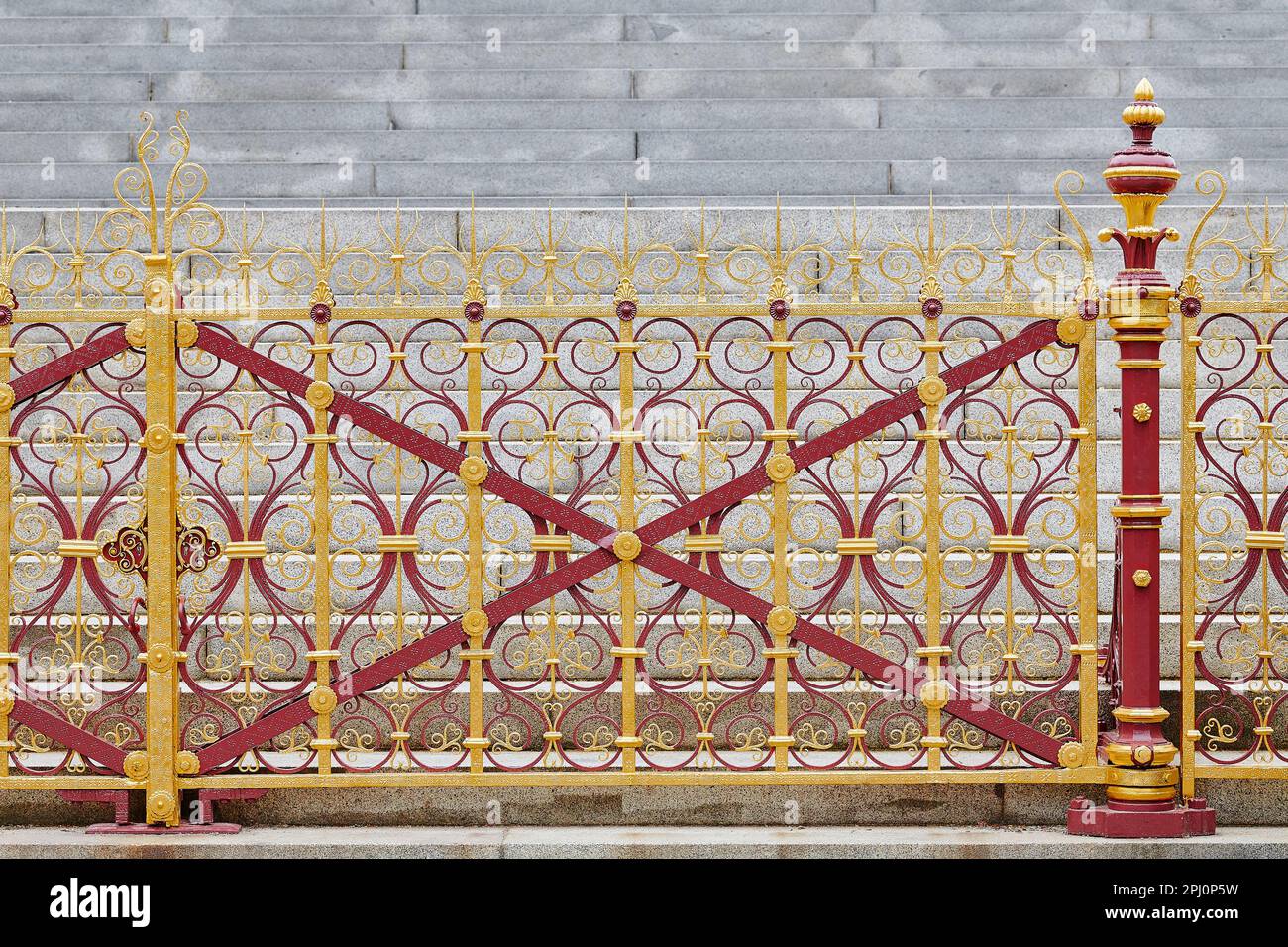 Colorful railings around the gilded statue of Prince Albert, husband of ...