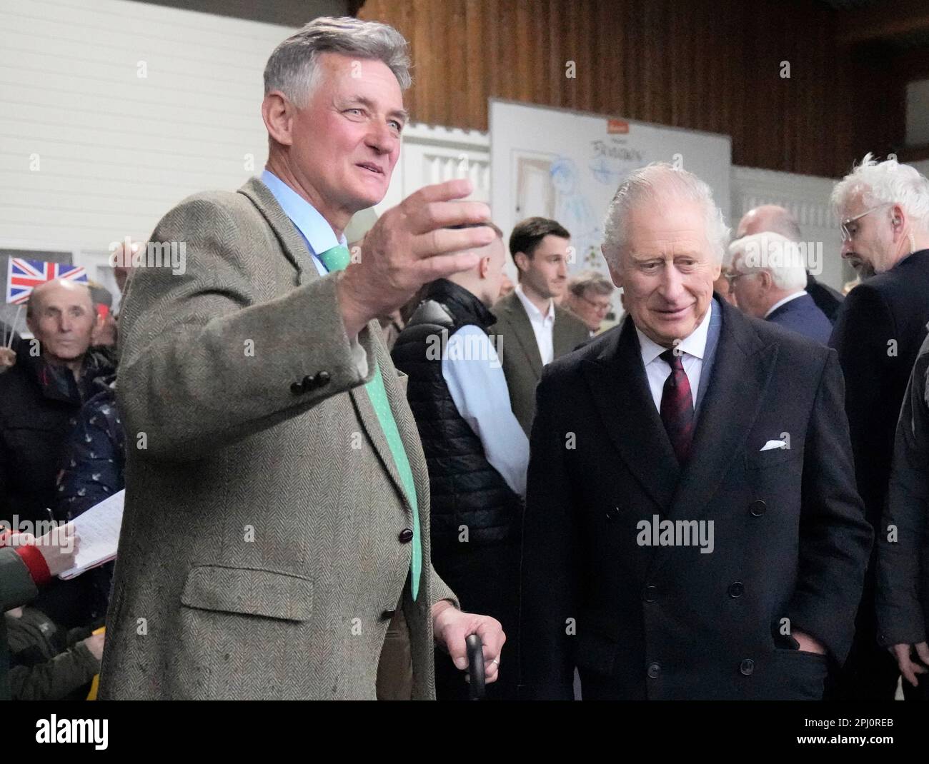 Brodowin, Germany. 30th Mar, 2023. Britain's King Charles III (r) talks ...
