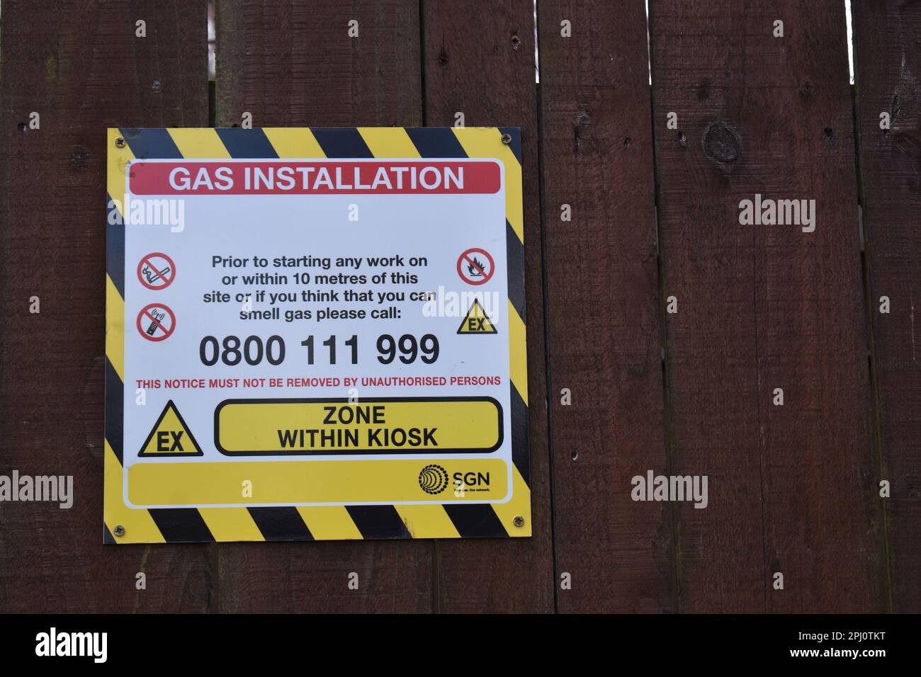 A warning notice on a fence about a gas installation with copy space ...