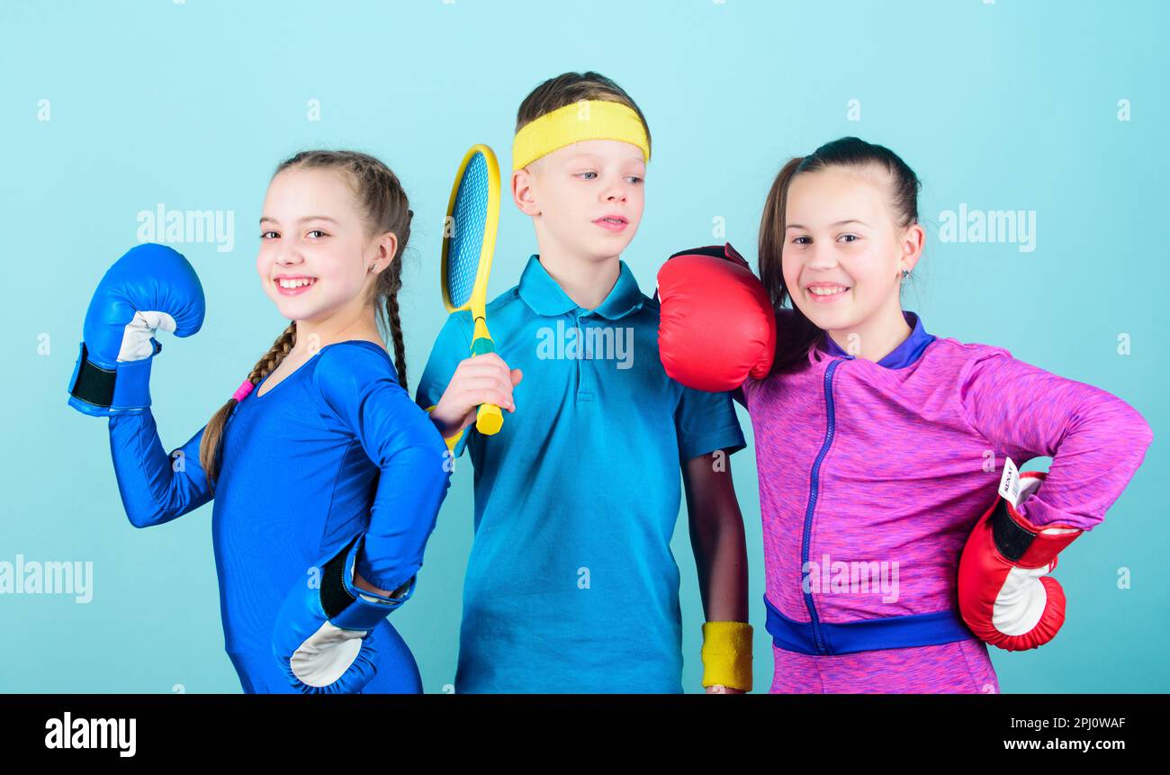 Great progress. Happy children in boxing gloves with tennis racket and ...