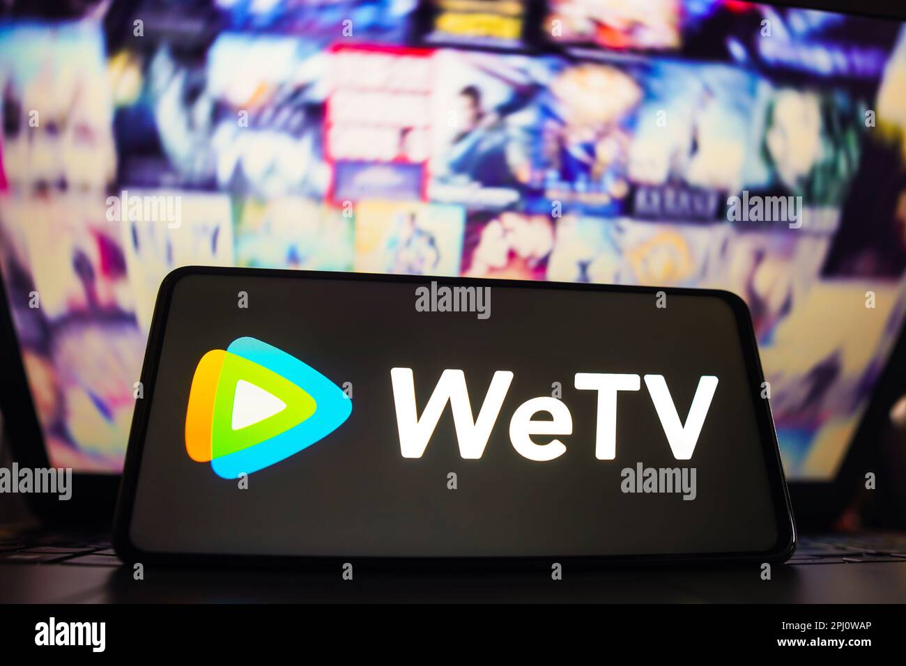 In this photo illustration, the WeTV logo is displayed on a smartphone screen Stock Photo - Alamy