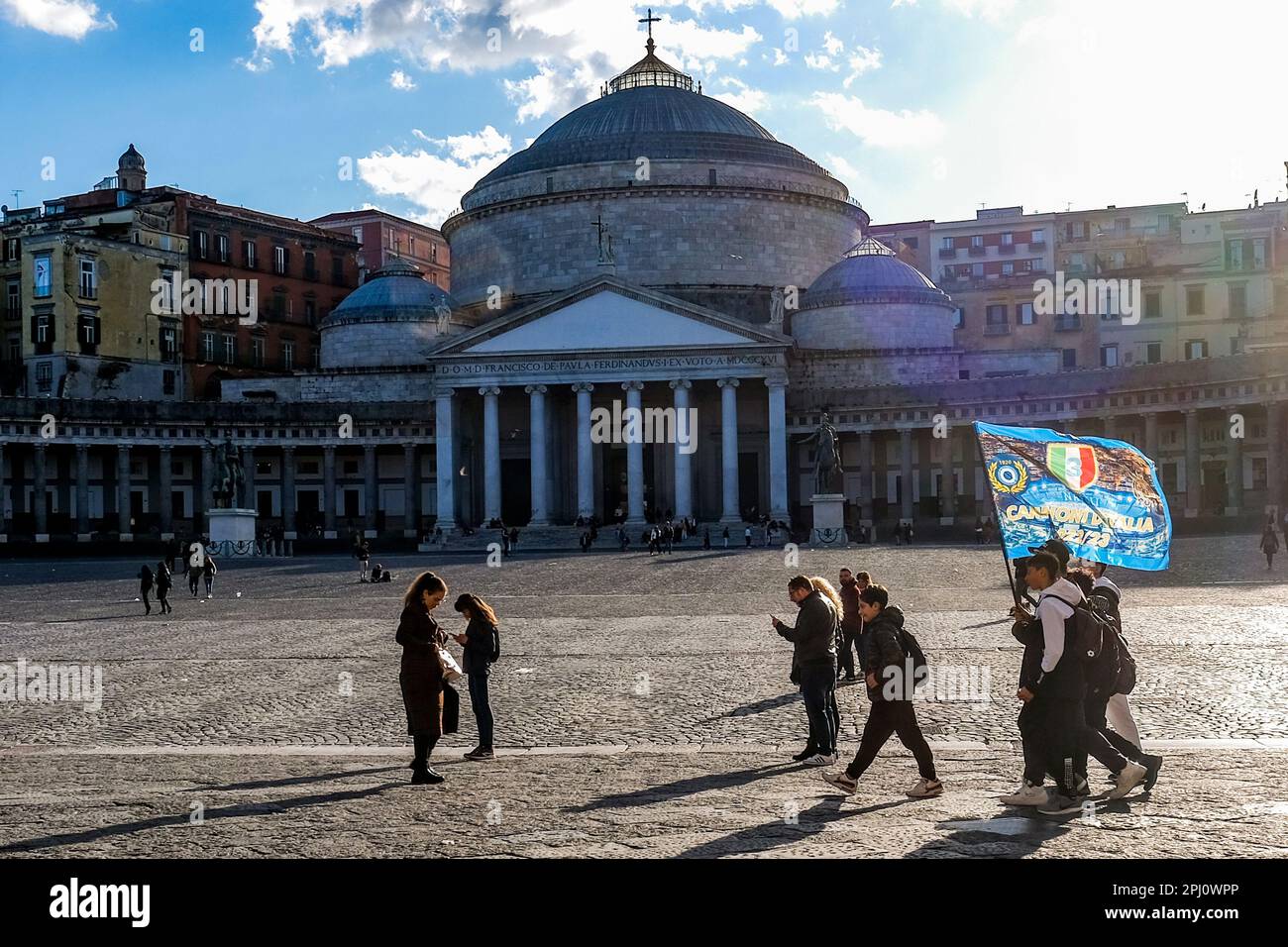 Boys walk in the main square of Naples Piazza del Plebiscito holding a ...
