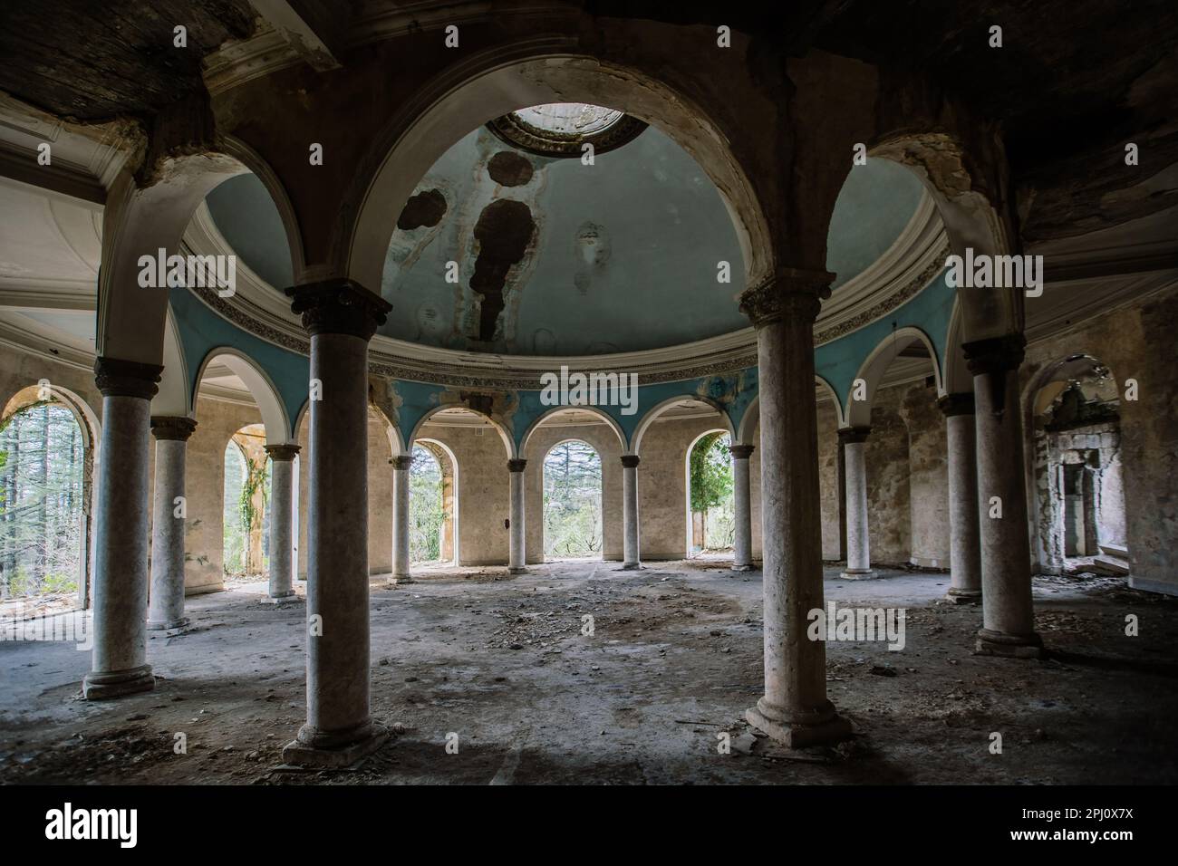 Round hall with colonnade in old abandoned palace Stock Photo - Alamy