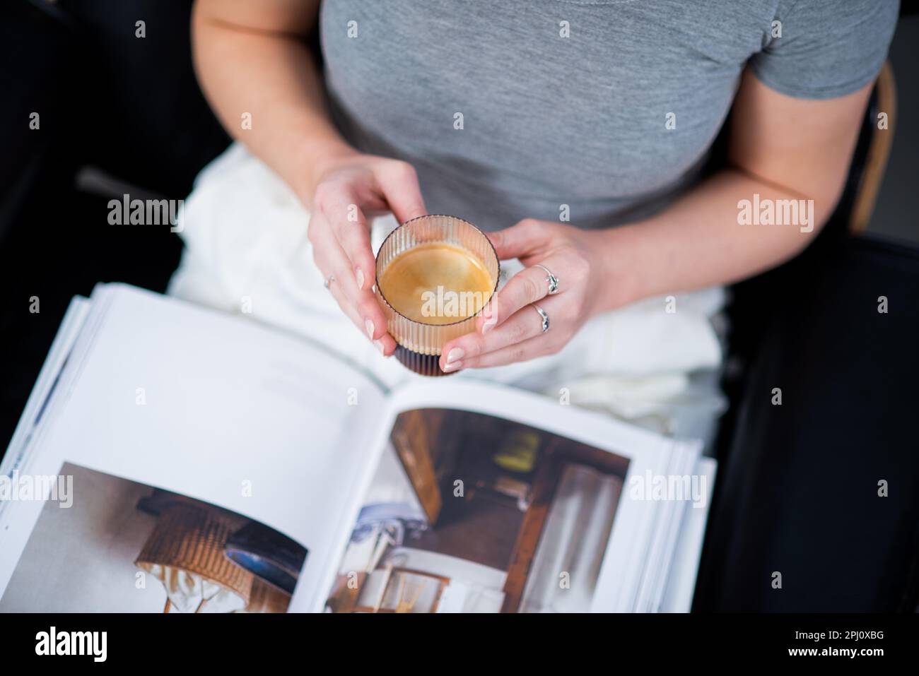 Girl reading magazine drinking coffee hi-res stock photography and ...