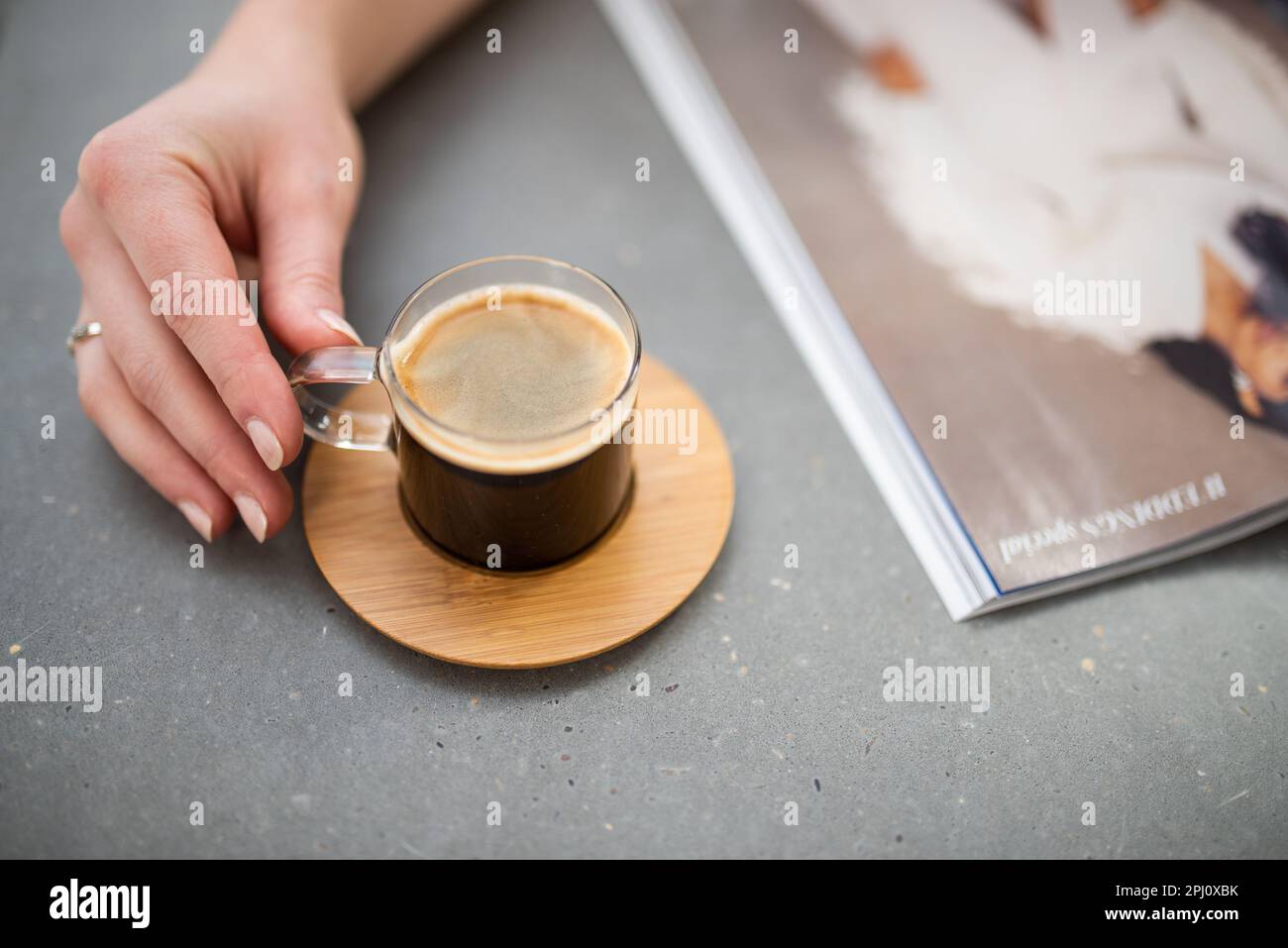 Girl reading magazine drinking coffee hi-res stock photography and ...