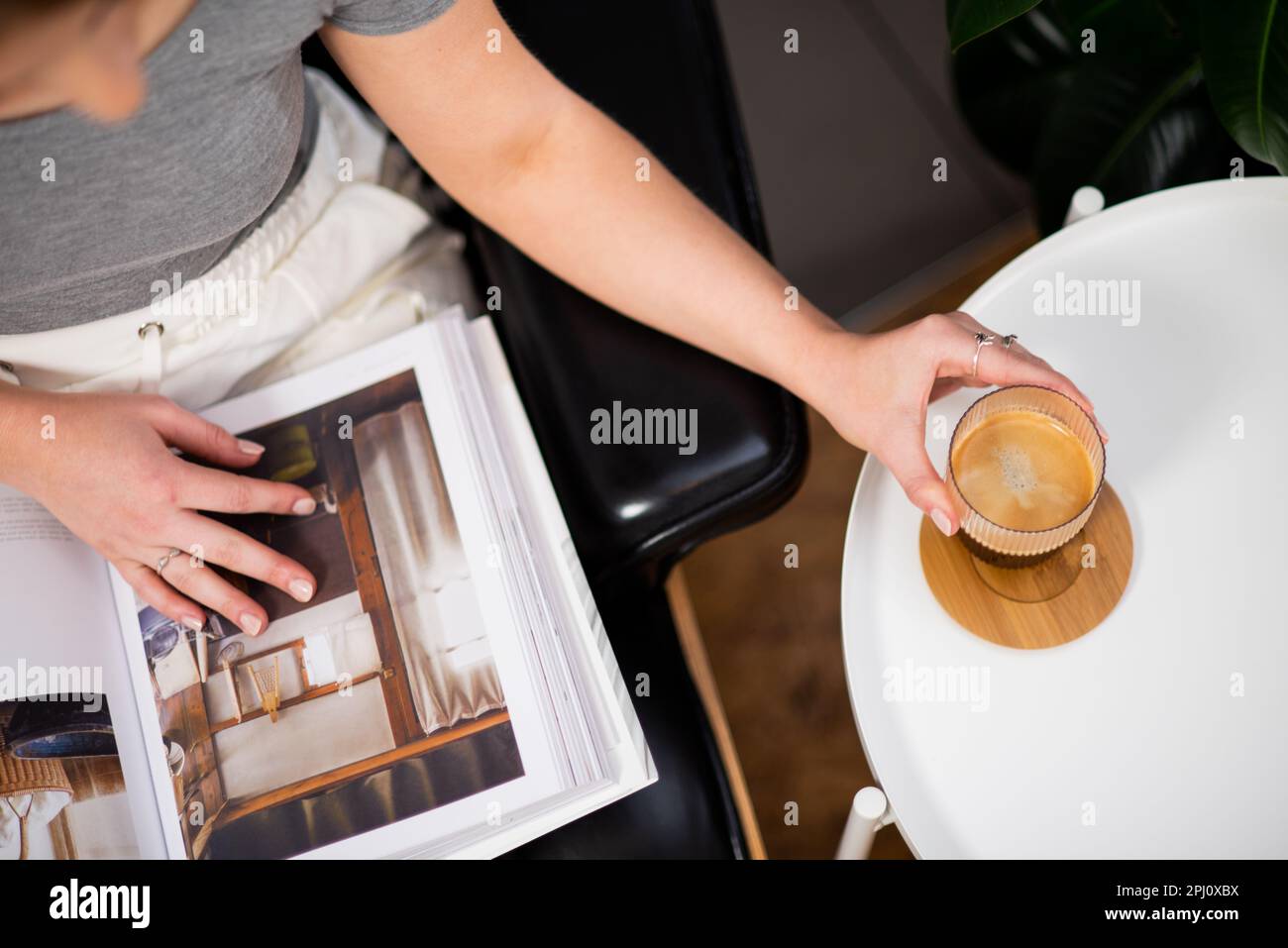 Girl reading magazine drinking coffee hi-res stock photography and ...