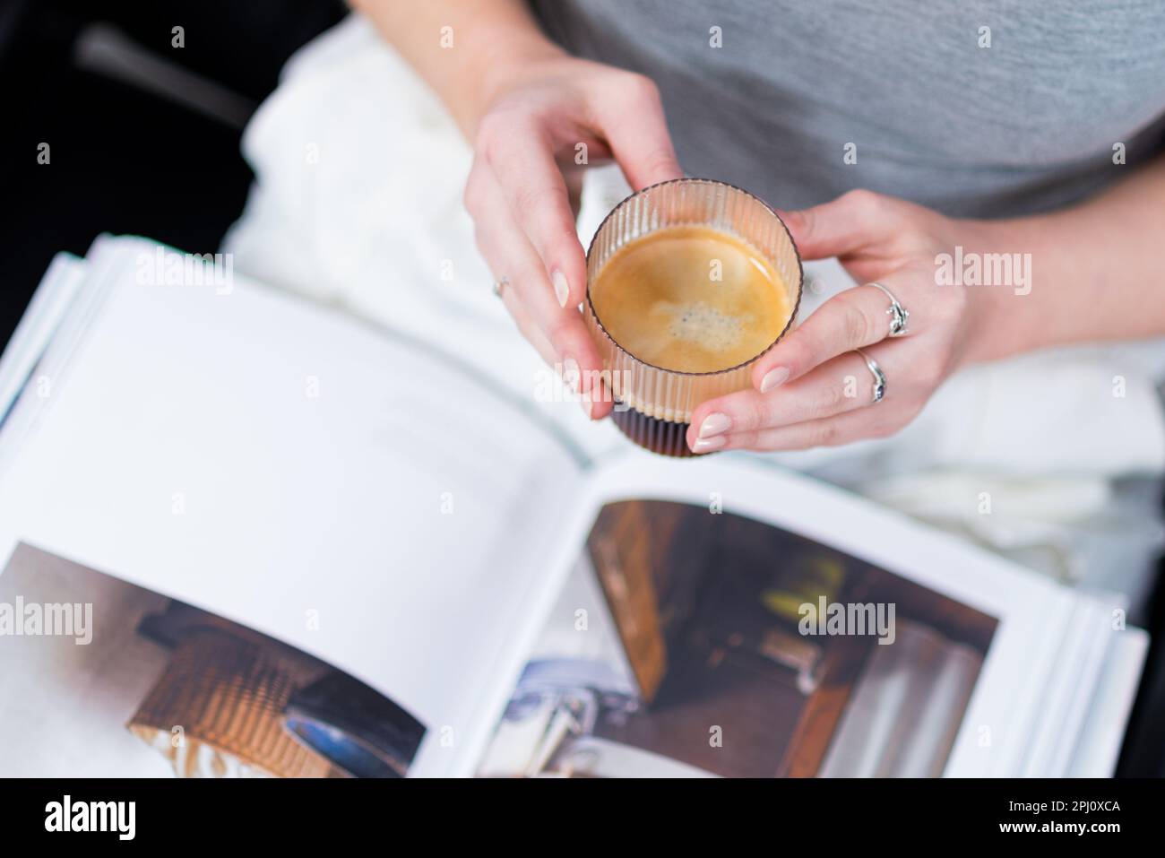 Girl reading magazine drinking coffee hi-res stock photography and ...