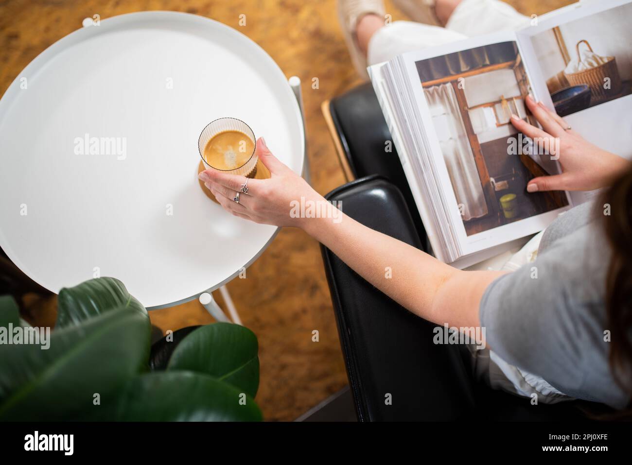 Girl reading magazine drinking coffee hi-res stock photography and ...