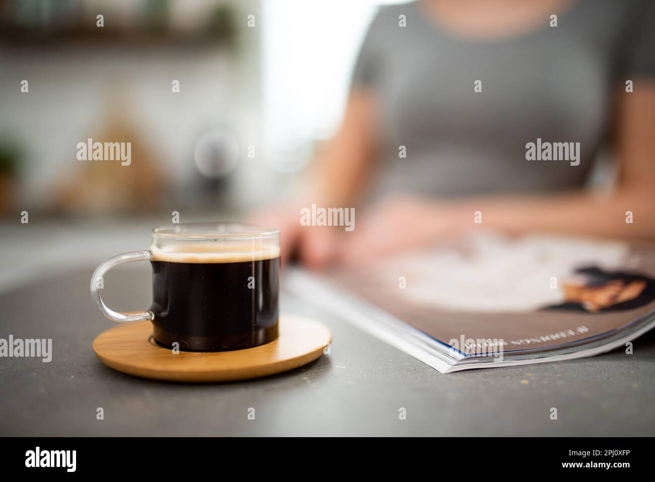 Girl reading magazine drinking coffee hi-res stock photography and ...