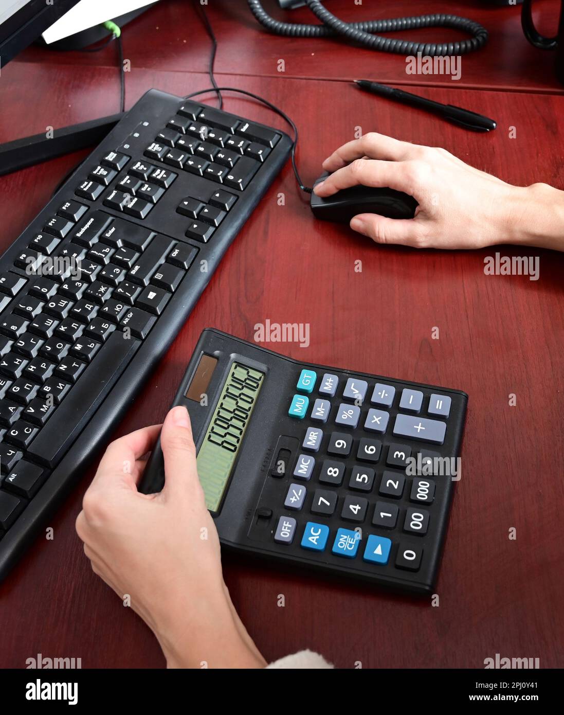 Analyst office work. Work desk with calculator, notepad and financial ...