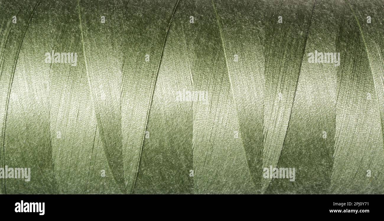Texture picture of sew thread green color. Close-up thread spool Stock ...