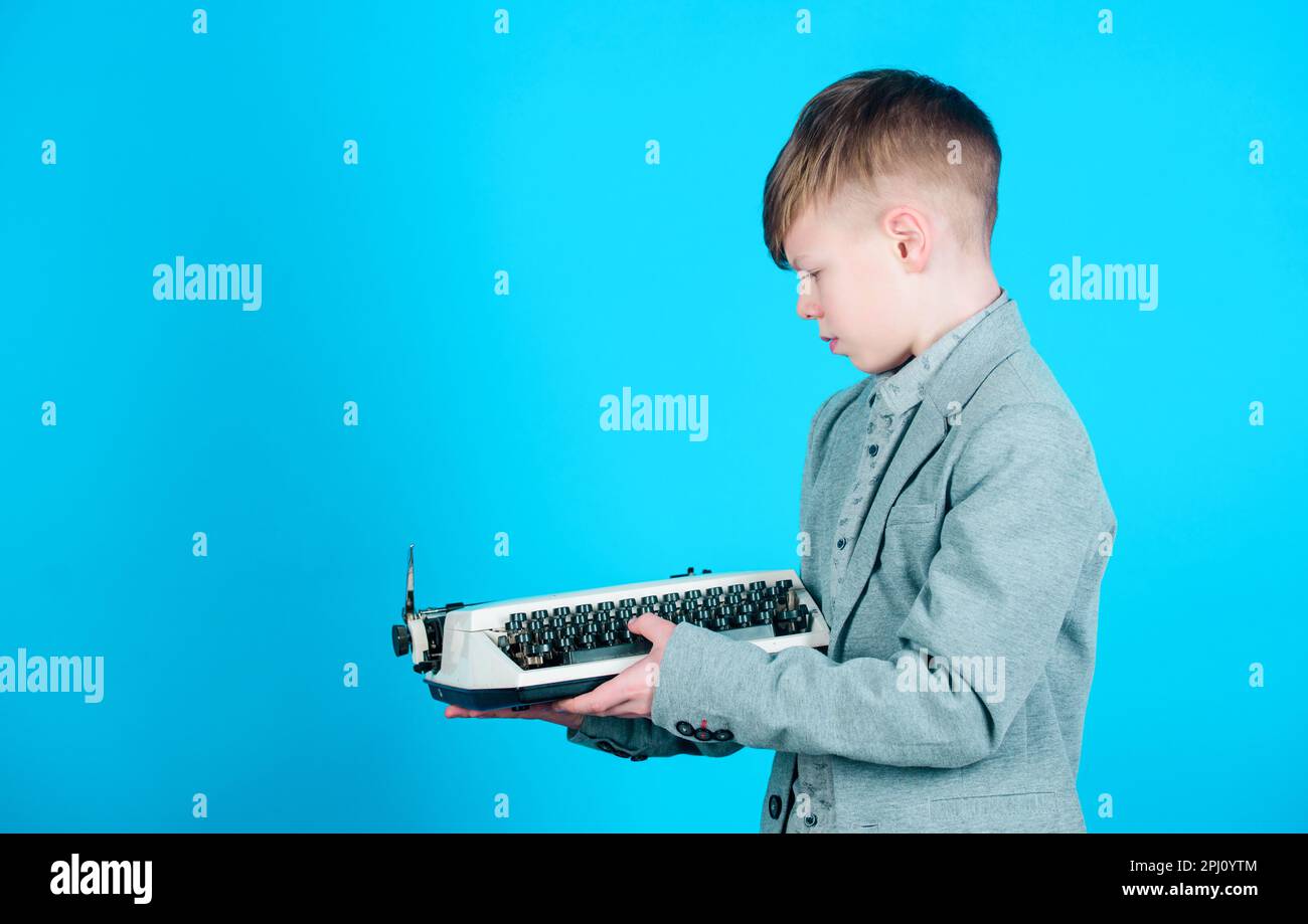 How does a retro typing machine work. Smart child using retro ...