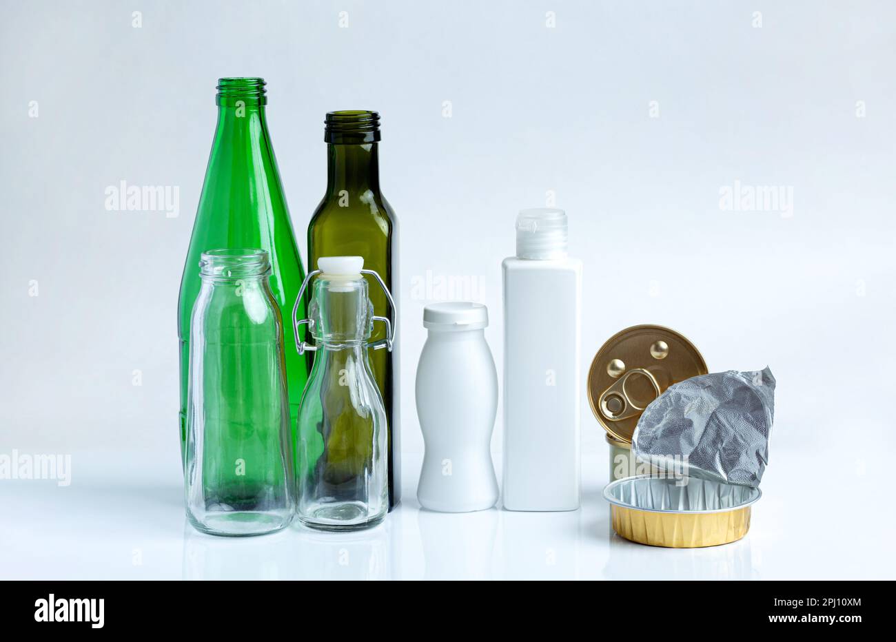 Garbage recycling concept. Empty glass, plastic and allumen jars and ...