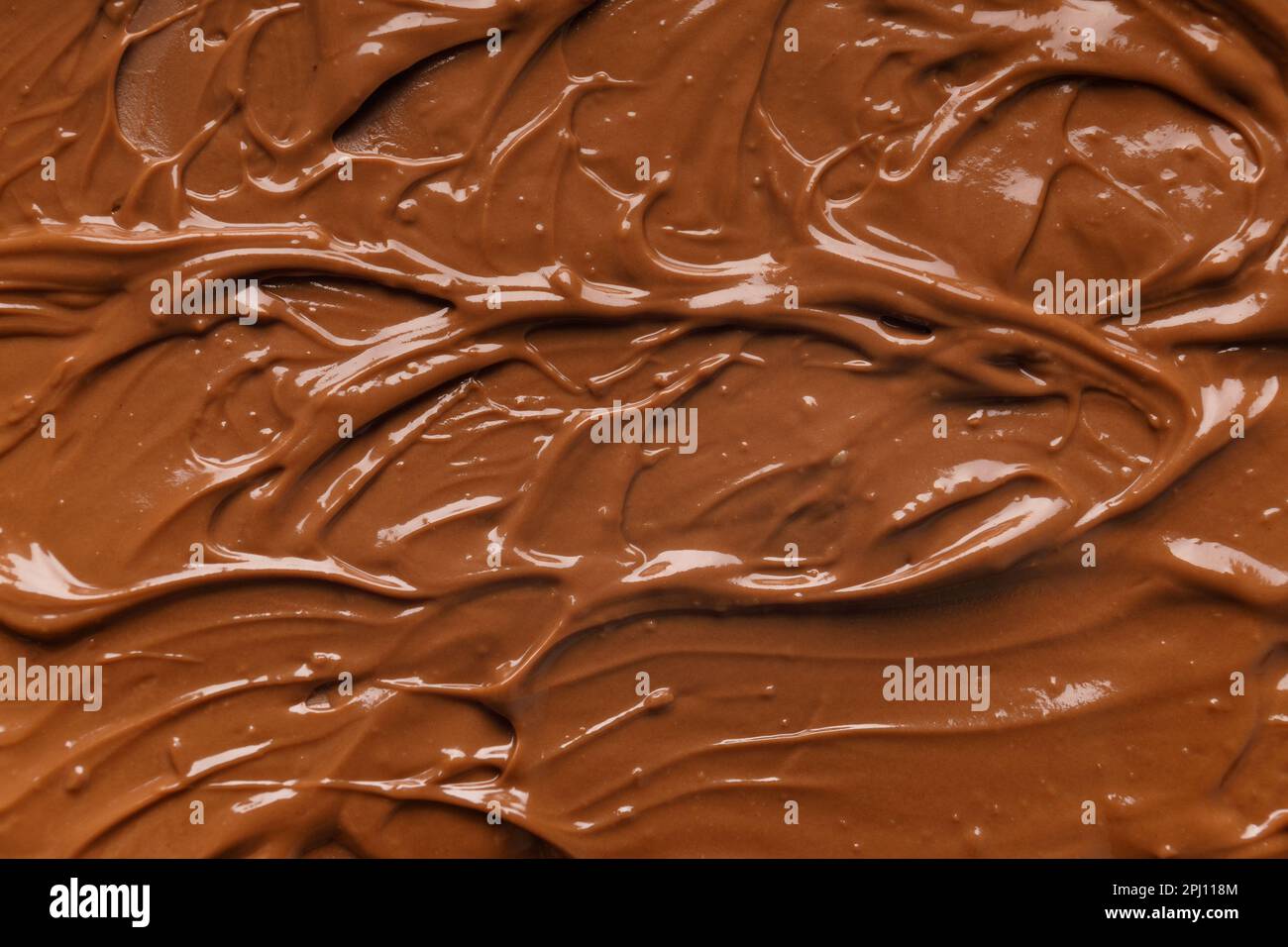 Chocolate background. Melted chocolate. Liquid milk chocolate. Handmade ...