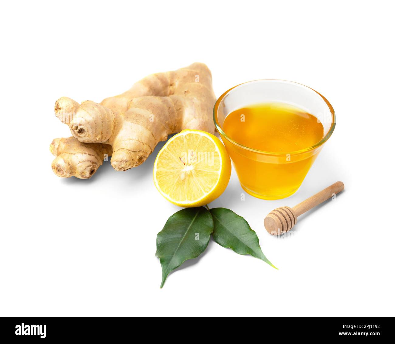 Organic honey in a glass transparent bowl, a wooden dipper, ginger and ...