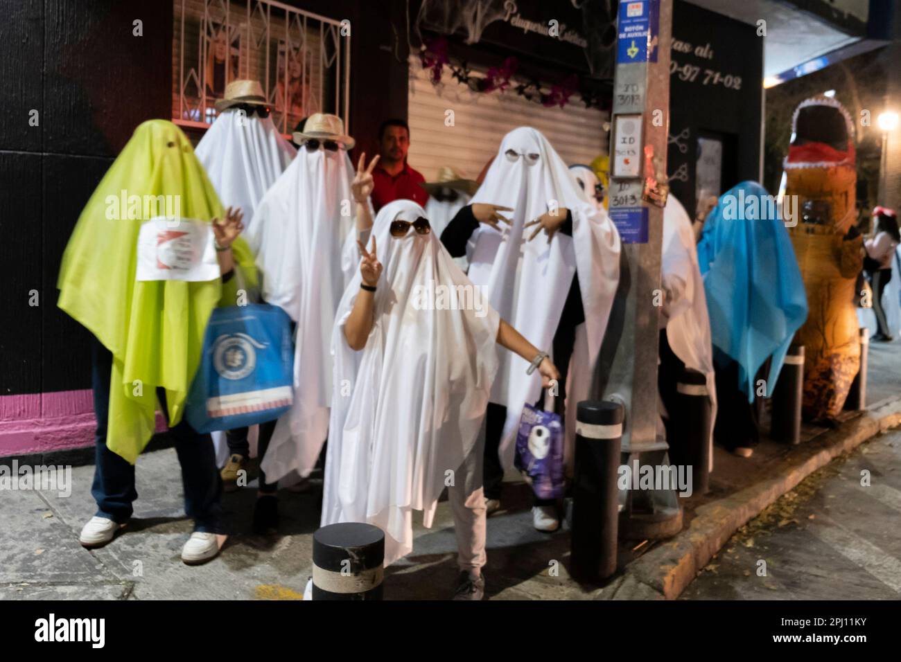 Halloween in Mexico City. People with halloween ghost costumes asking ...