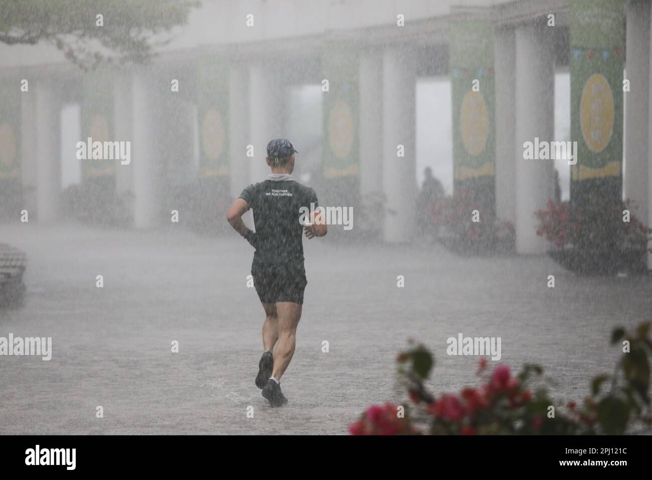 A man running during a stormy day in Tsim Sha Tsui. 25MAR23 SCMP ...